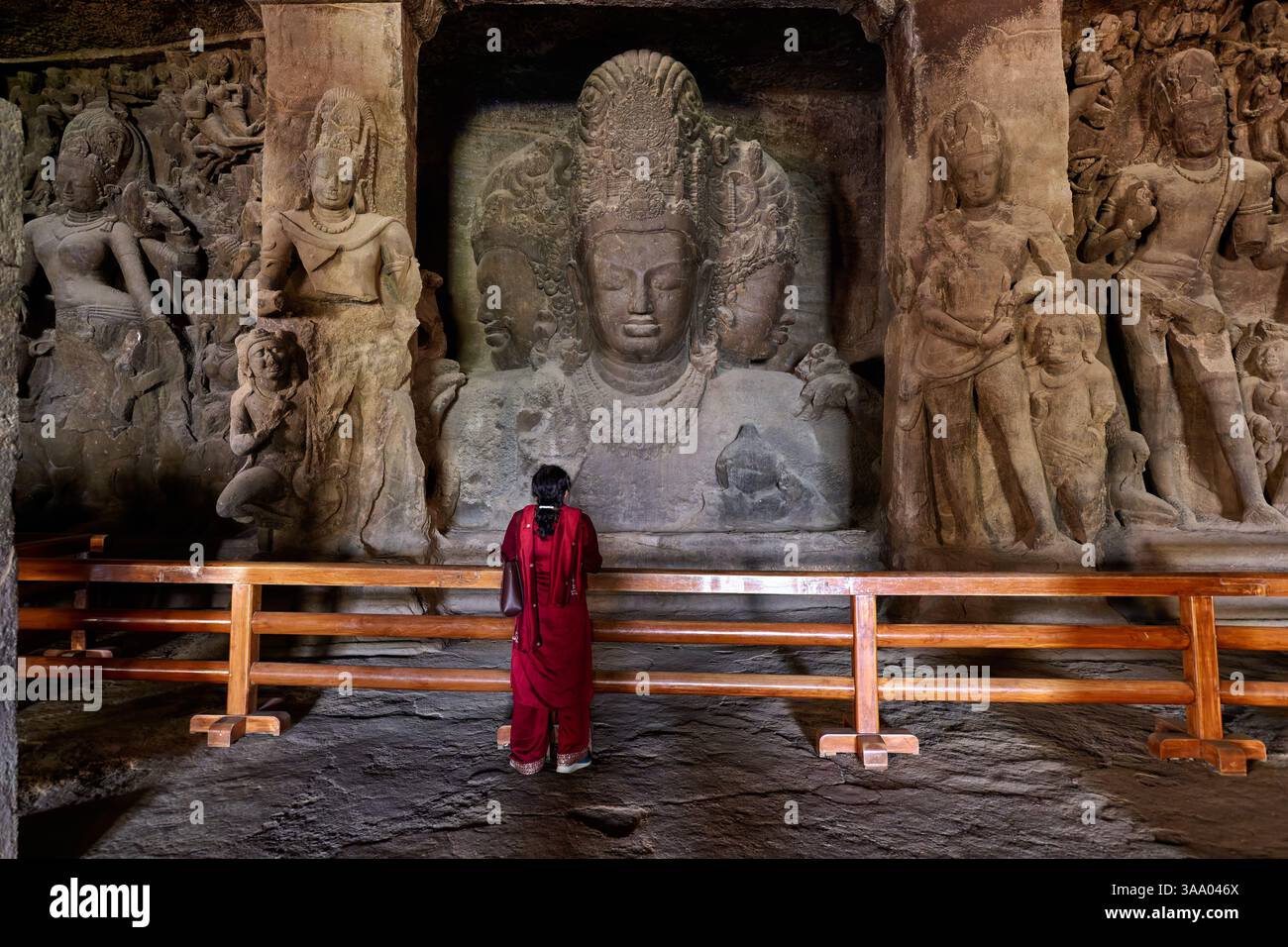 tourist in front of the Eternal Shiva, the Sadashiva, Elephanta caves ...