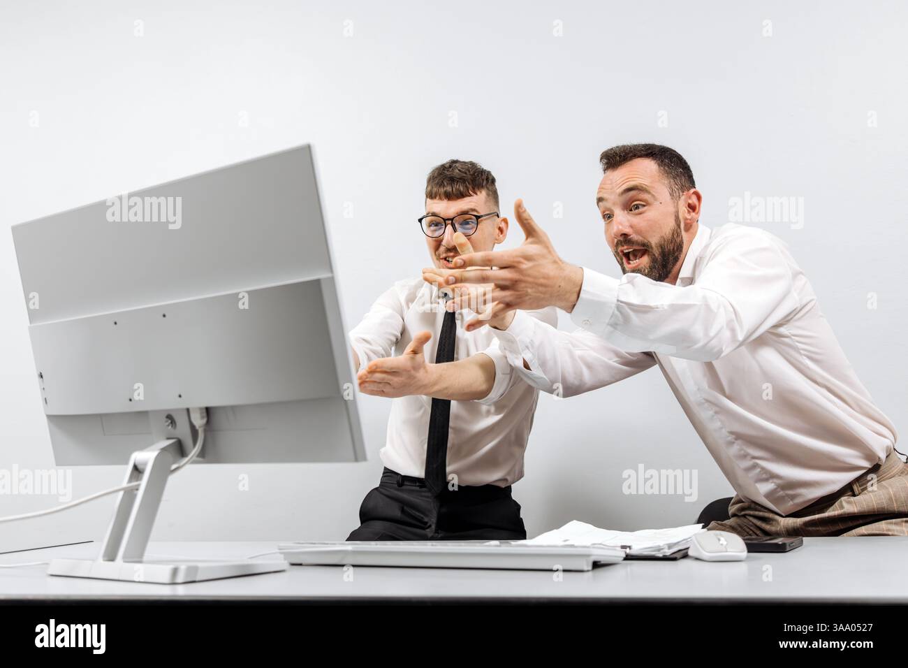 Two businessmen in the office rejoicing and showing enthusiasm for the ...