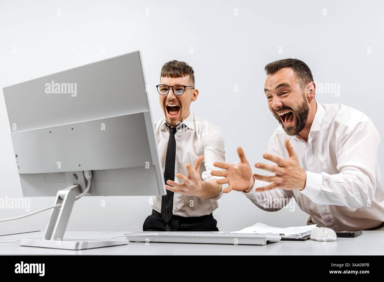 Two businessmen in the office rejoicing and showing enthusiasm for the ...