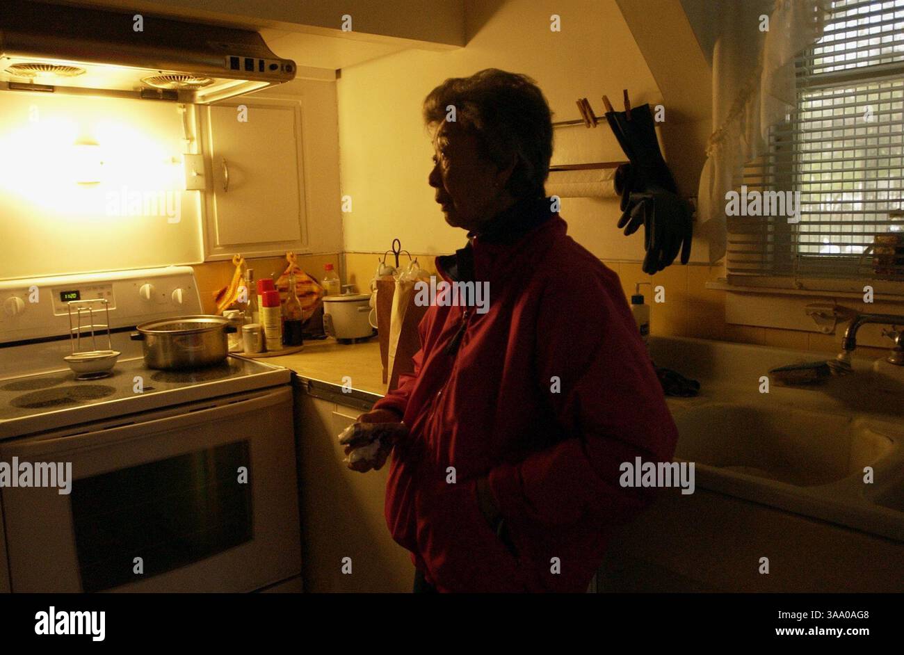 JUMP - Connie King (cq, of Locke), standing in the kitchen of her home ...