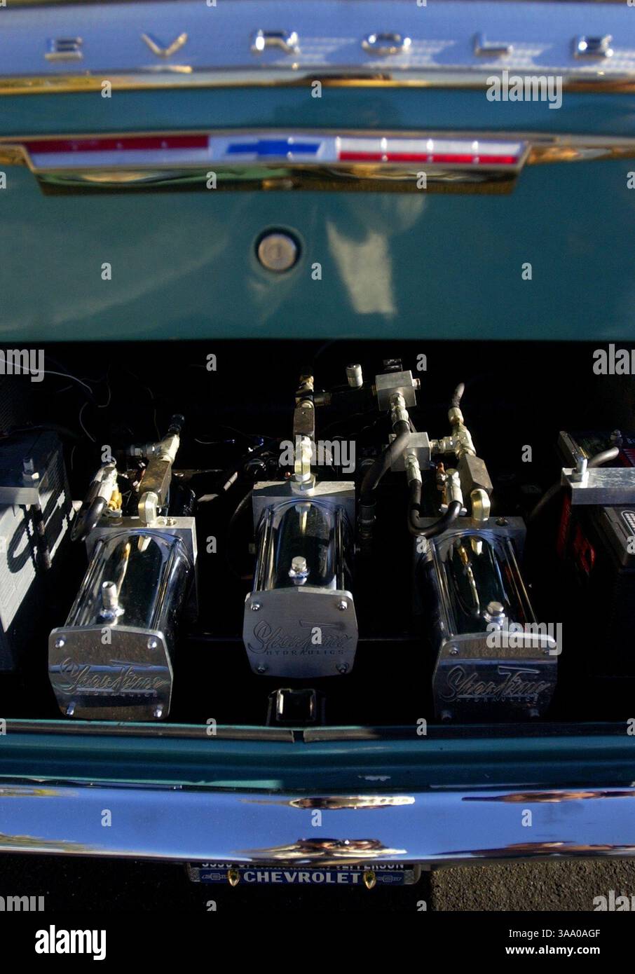 JUMP - Hydraulics are mounted in the trunk of Max Alvarado's lowrider ...