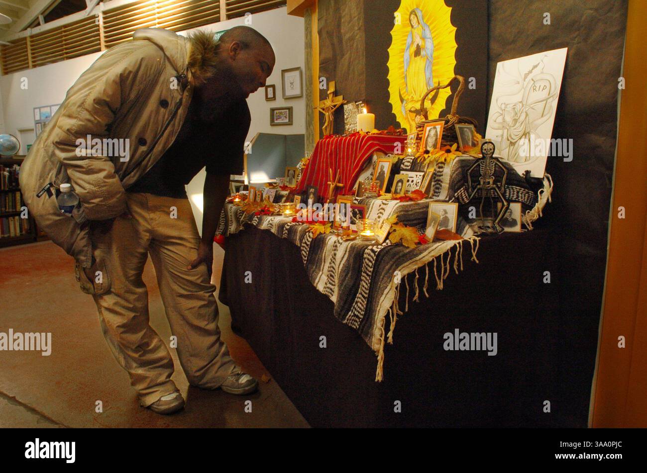 LEDE -- Lewis Riley, (cq), a guest at Loaves and Fishes looks at an ...