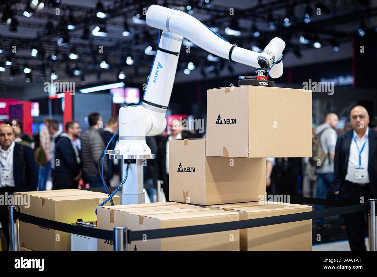 Hanover, Germany. 31st Mar, 2025. A robotic arm stacks boxes at the ...