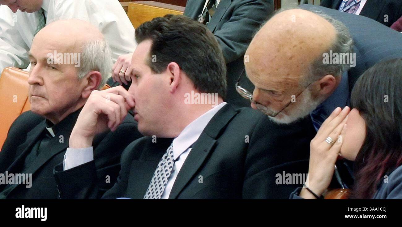 May 05, 2006; Toledo, OH, USA; Rev. GERALD ROBINSON (L) listens to ...