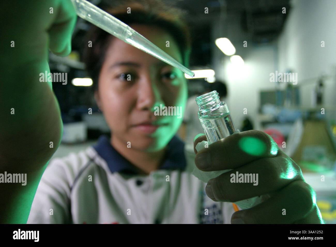 May 07, 2006; Bangkok, THAILAND; An aquarium tech checks water for quality control at the Siam ...