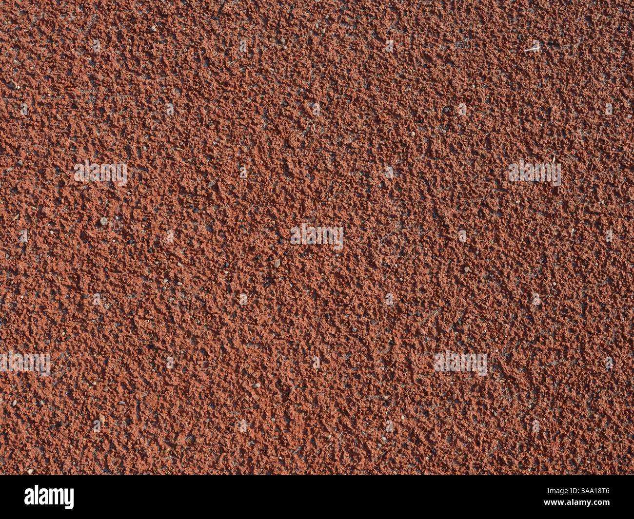 Close-up and top view to rubberized brown running track on stadium with ...