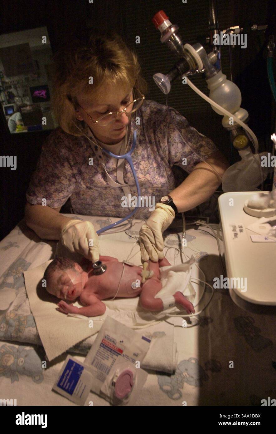 A neo-natal intensive care nurse measures the chest of Preana Khamsa ...