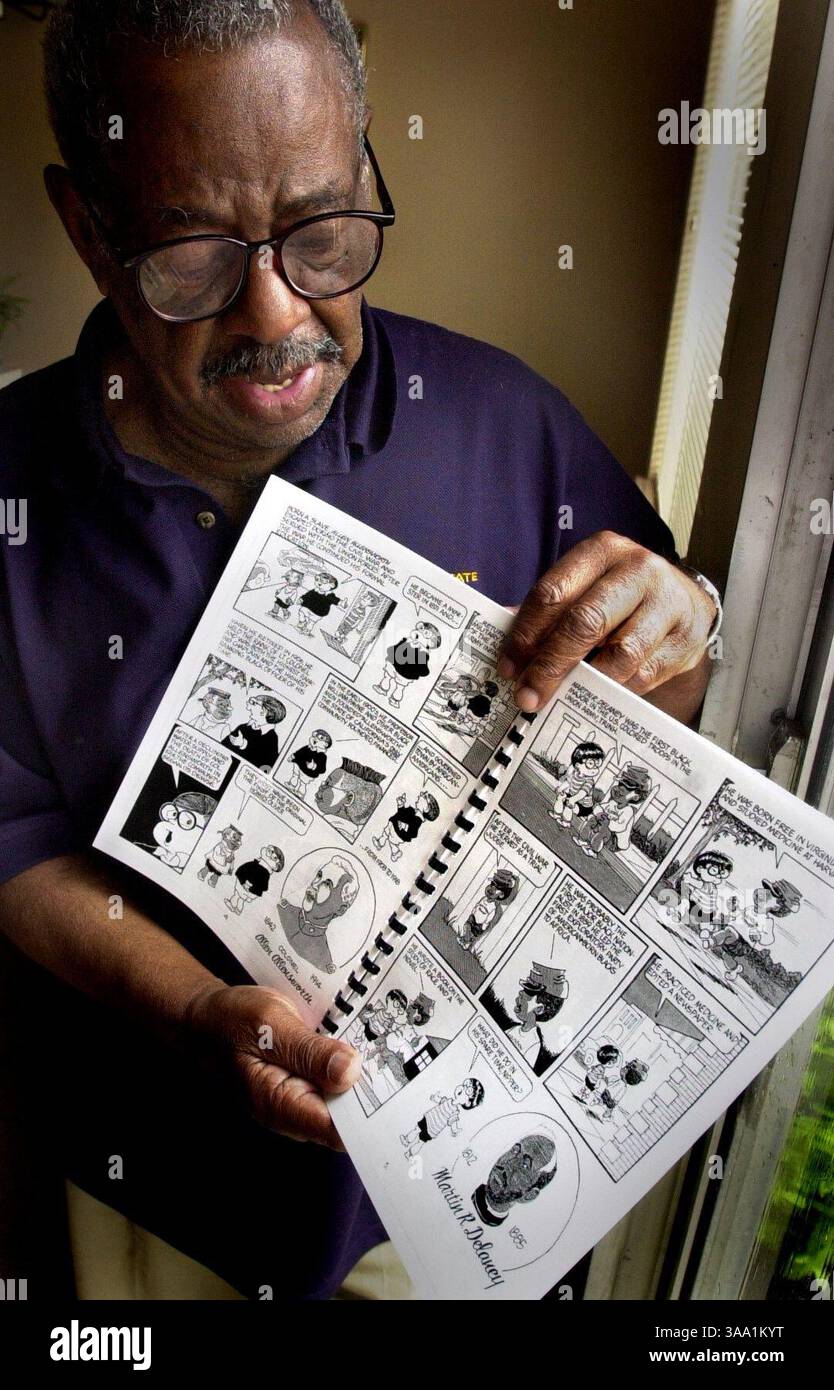 Cartoonist Morrie Turner shows off hsi latest comic book that salutes ...