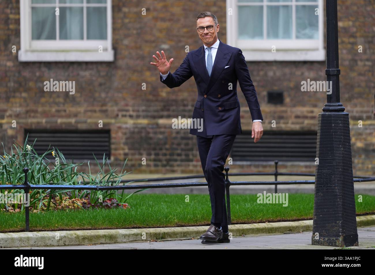 President of Finland Alexander Stubb waves as he arrives to meet ...