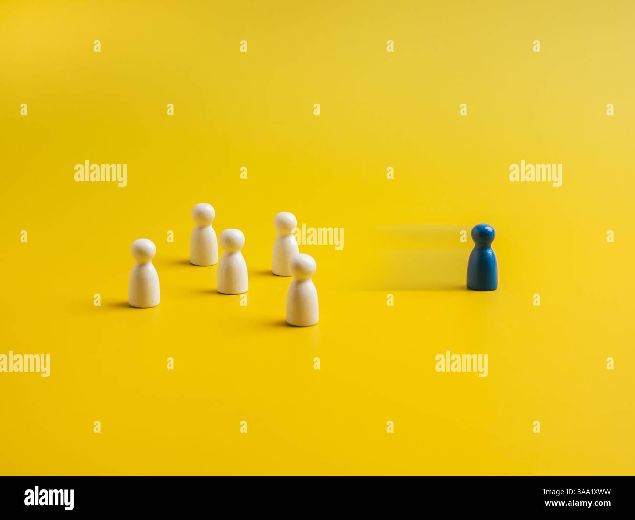 The blue different one, moving out from the group of white peg dolls ...