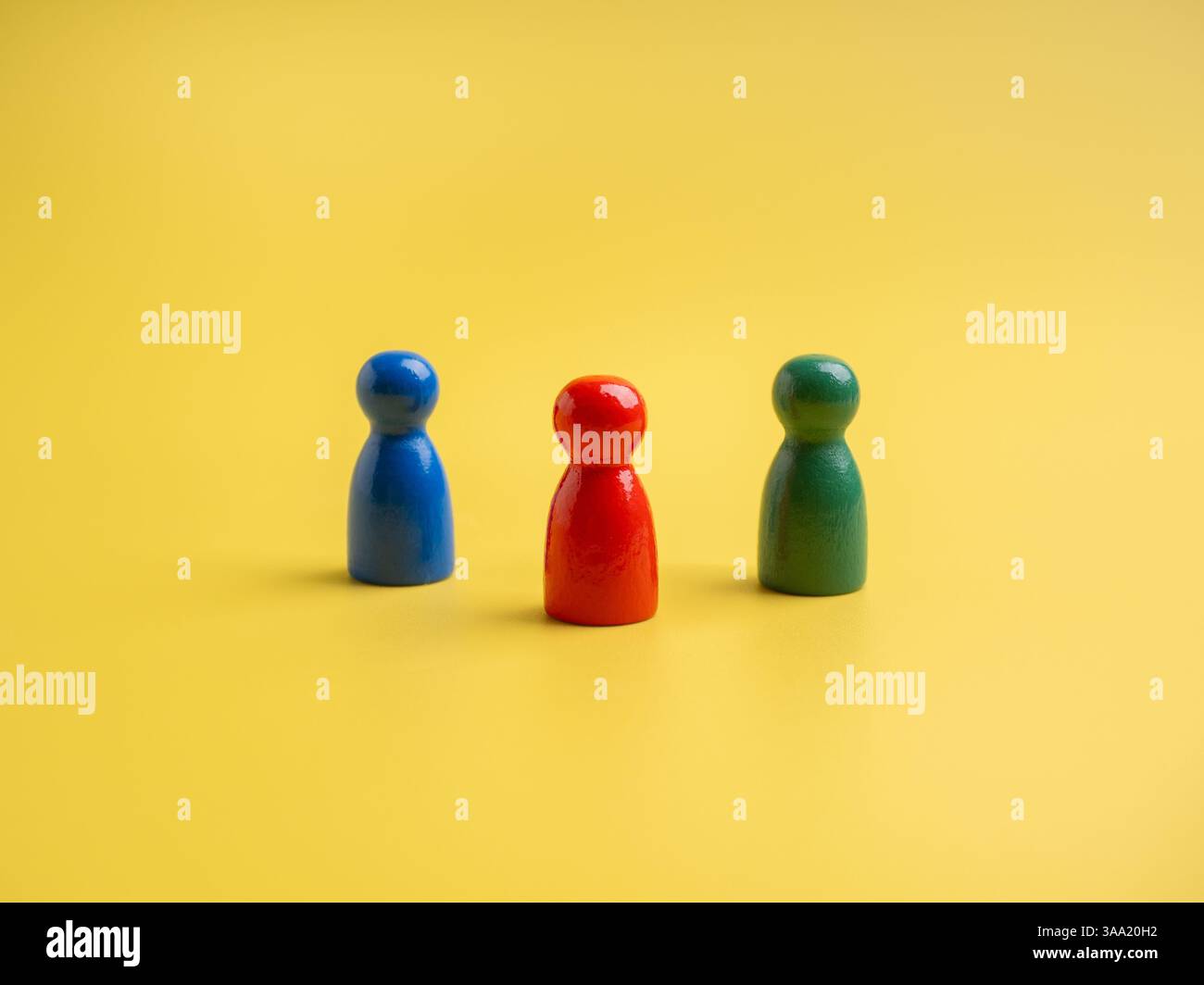 The red, green and blue, different colors of peg dolls standing ...