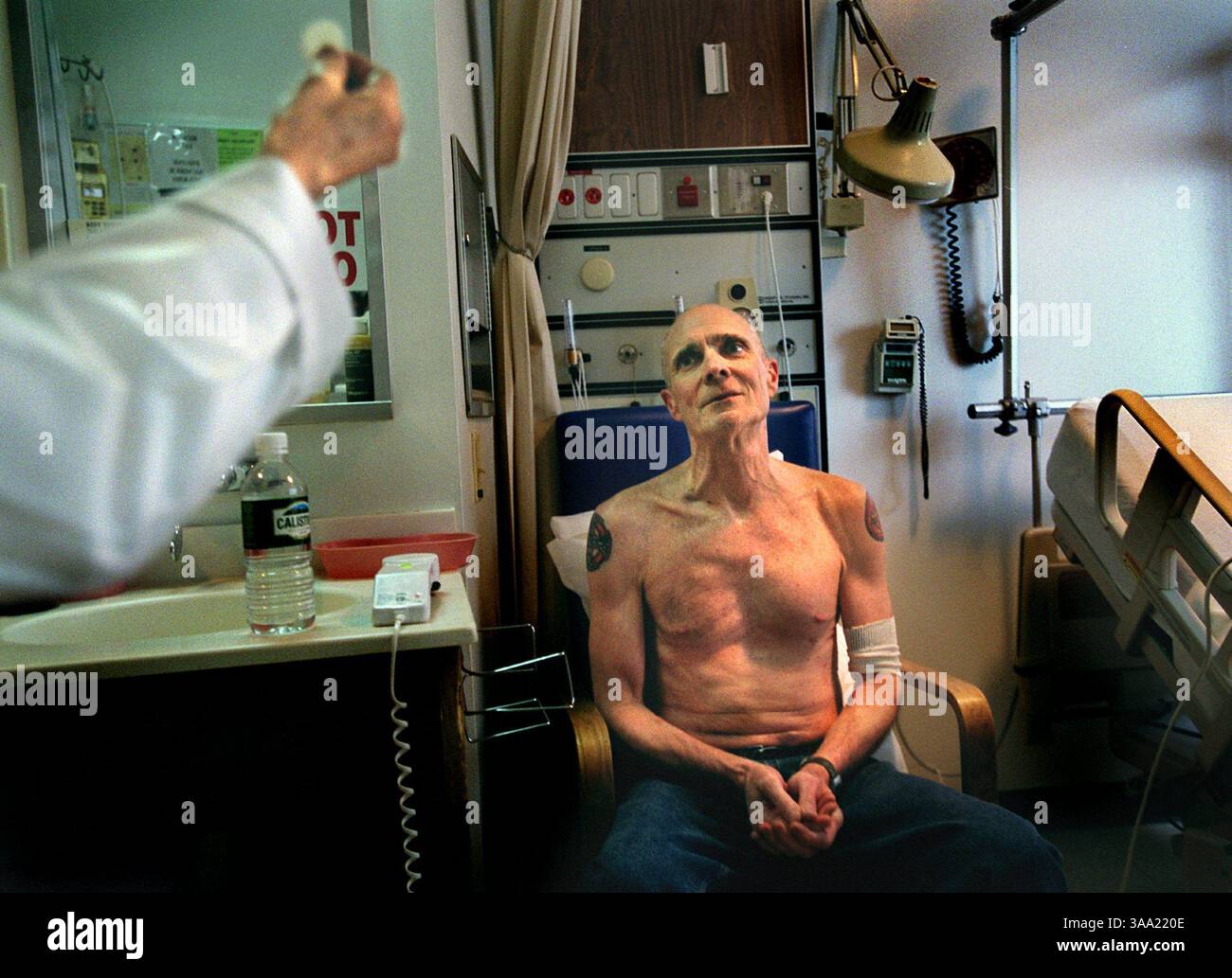 Paul, who once studied to become a priest, receives communion from eucharistic minister, Zenaida ...