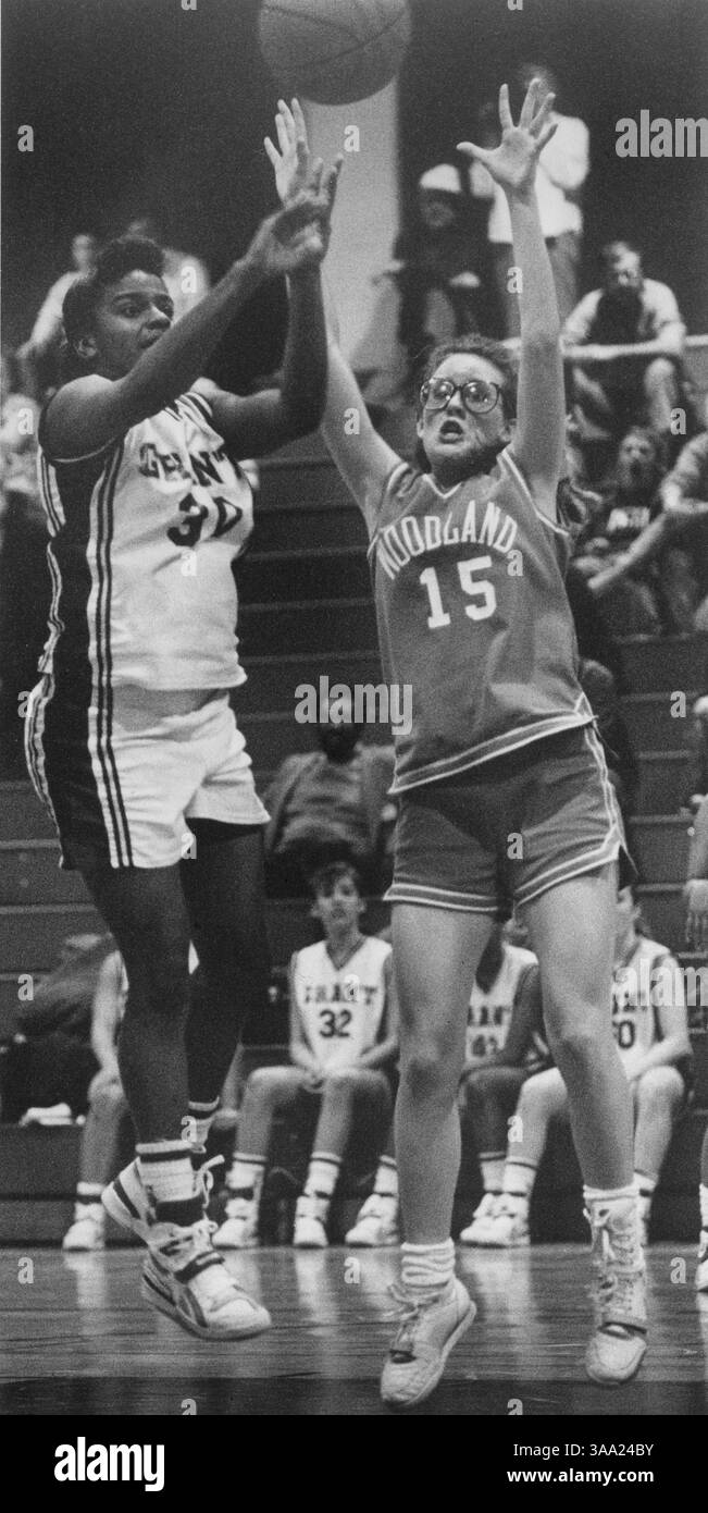 Grant High star Tesia Green puts up a shot against Woodland's Marilee ...