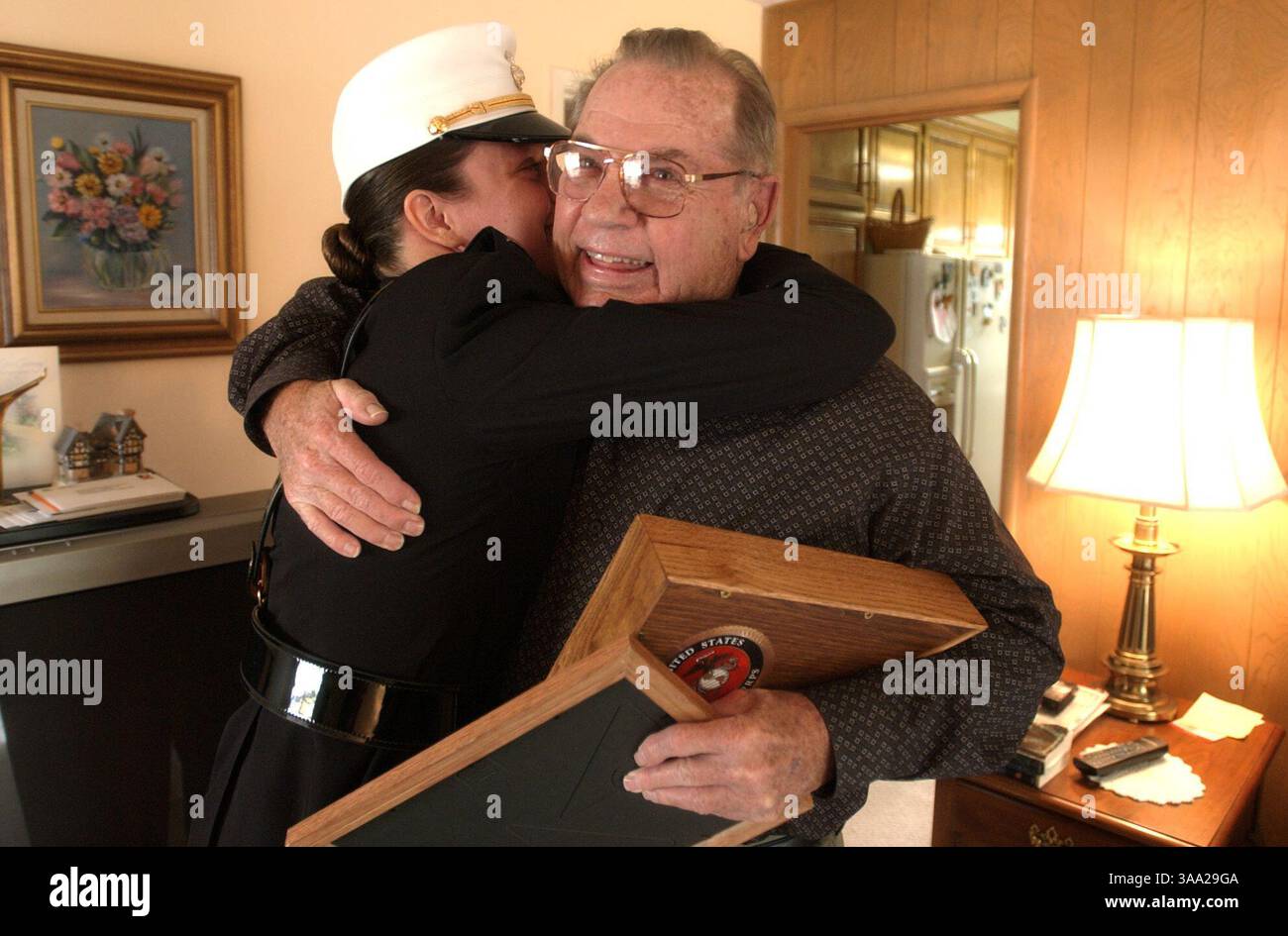 LEDE -- Kate Slocum, left, a Lt. in the Marines hugs former Marine ...