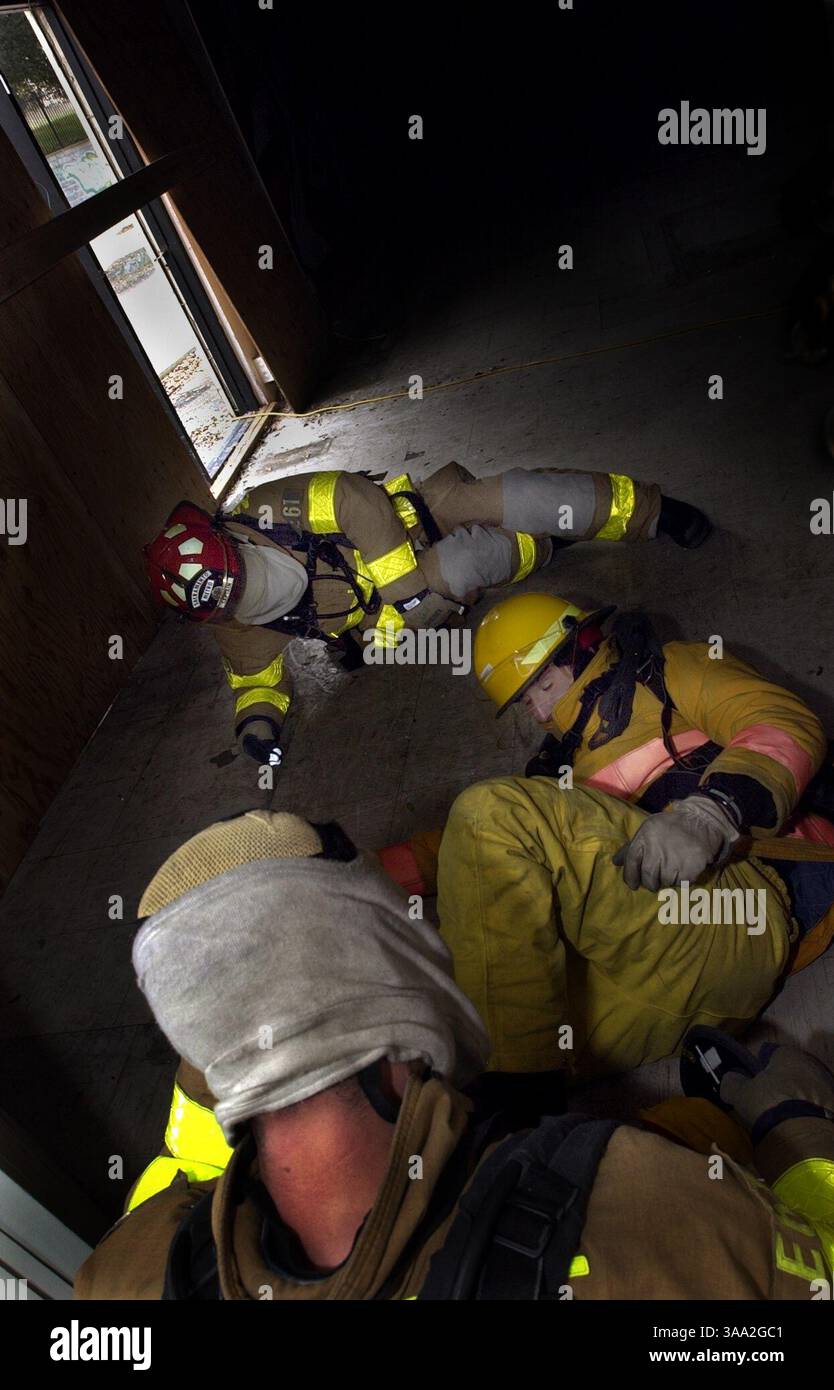 Sacramento Metro Fire captain Rennie James (top) catches his breath ...