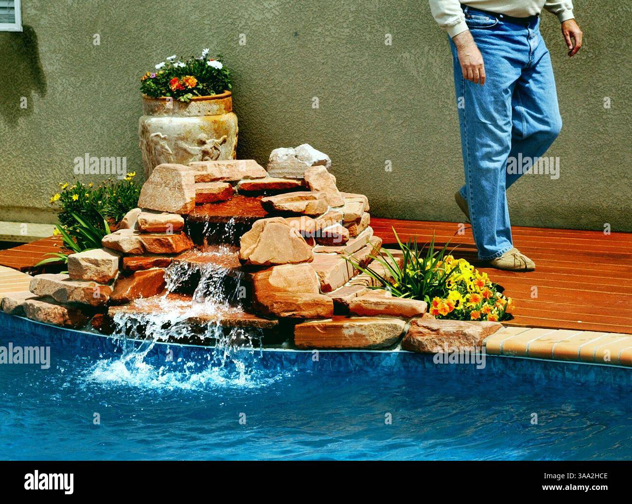 One of two rock waterfalls with flower plantings at Clague family ...
