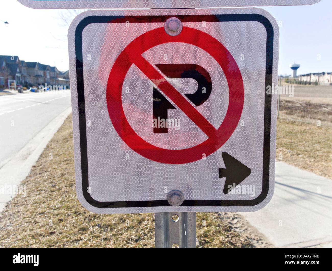 Clearly marked no parking sign alerts drivers to keep the street clear ...