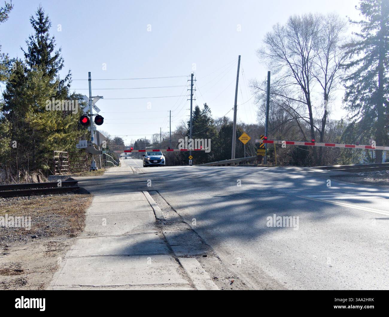Railroad barrier lowered signaling drivers to stop for approaching ...