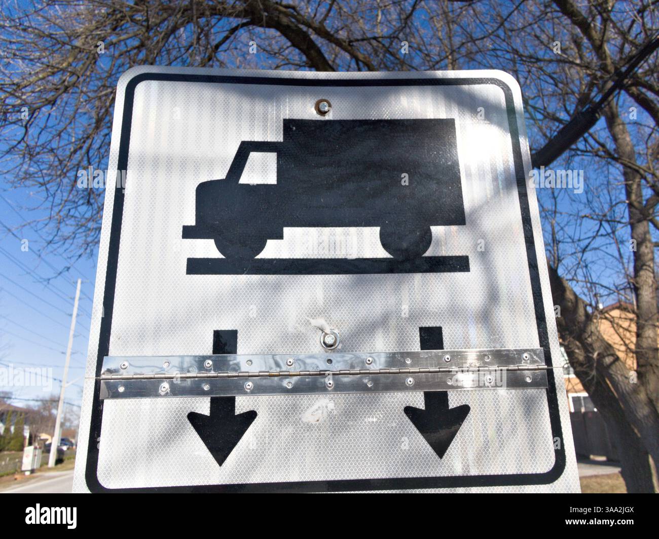 Road safety sign highlights axle weight limits for trucks emphasizing ...