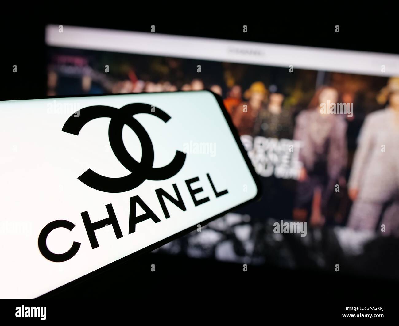 In this photo illustration, a smartphone with the logo of French luxury ...