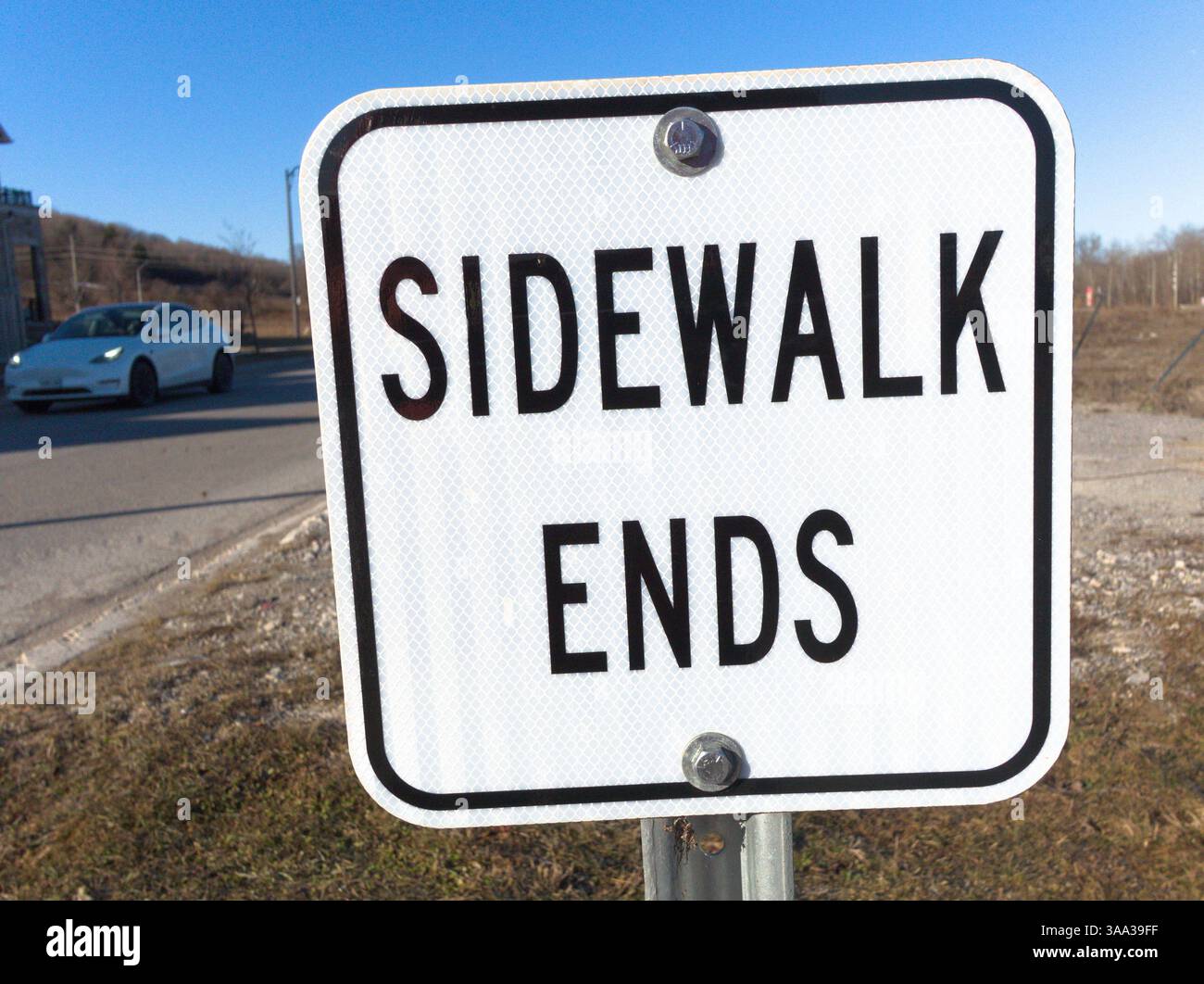 Standing at the edge of structured pathways, this sign embodies the ...