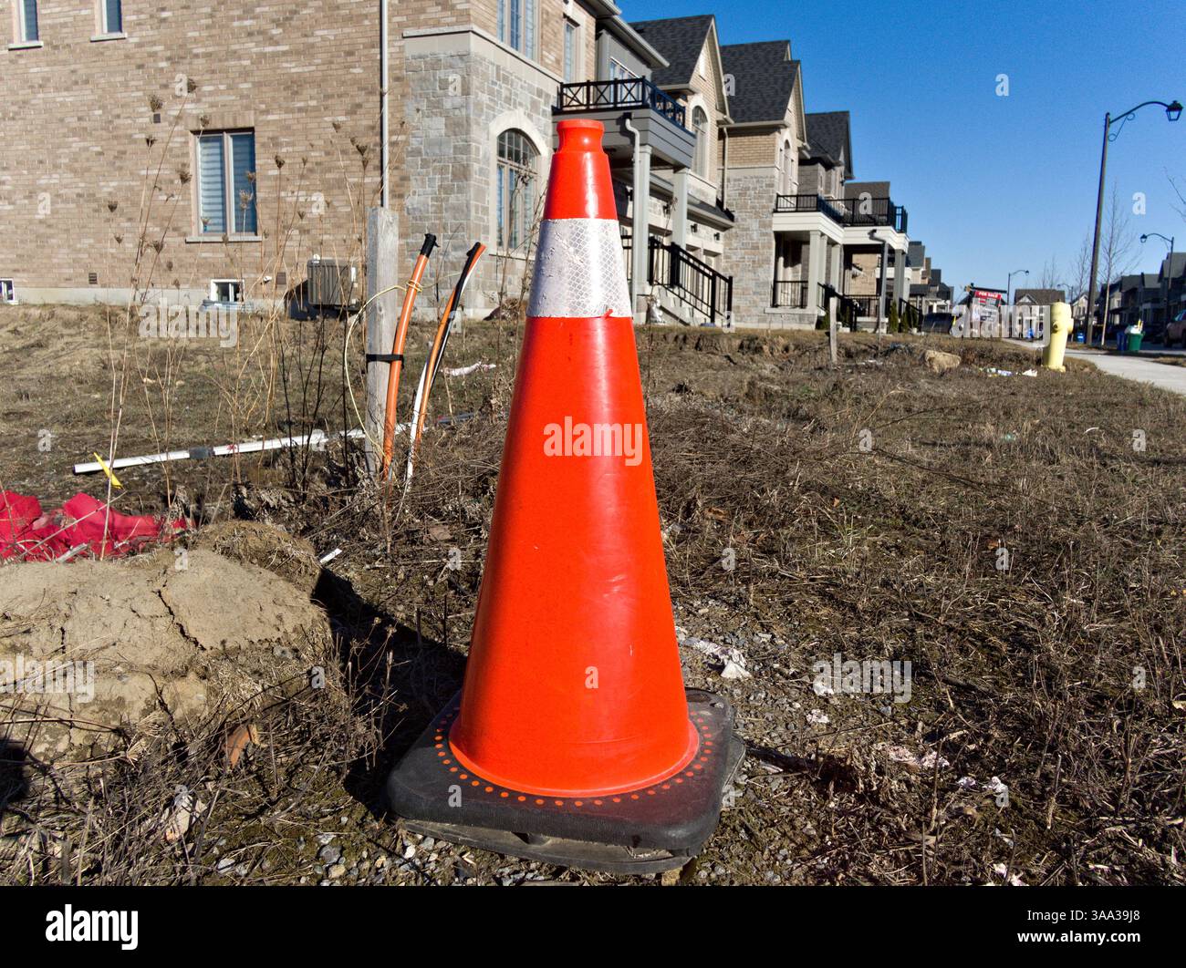 In the midst of suburban expansion, a single reflective cone catches ...