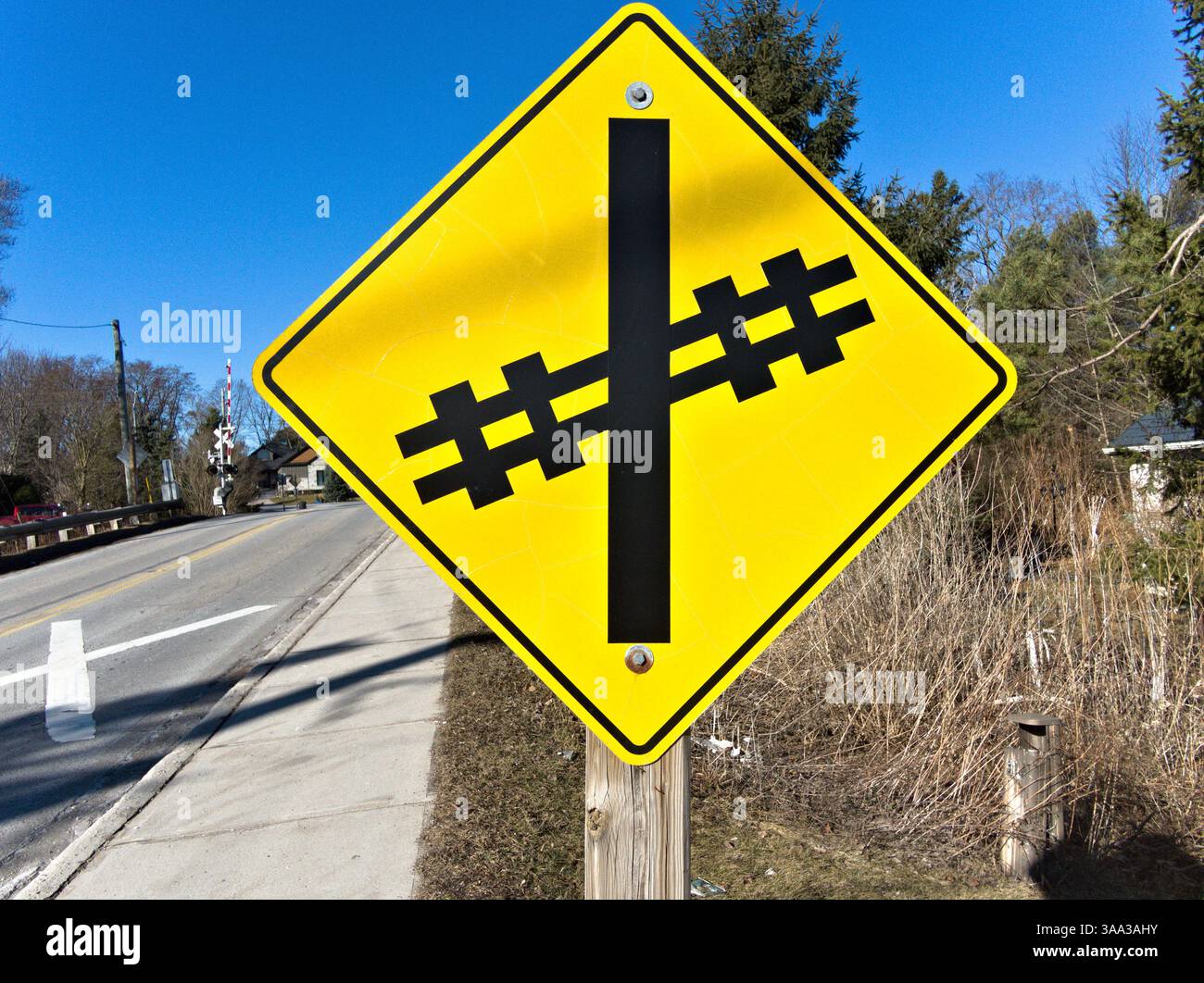 Brightly marked intersection sign alerts drivers to the approaching ...