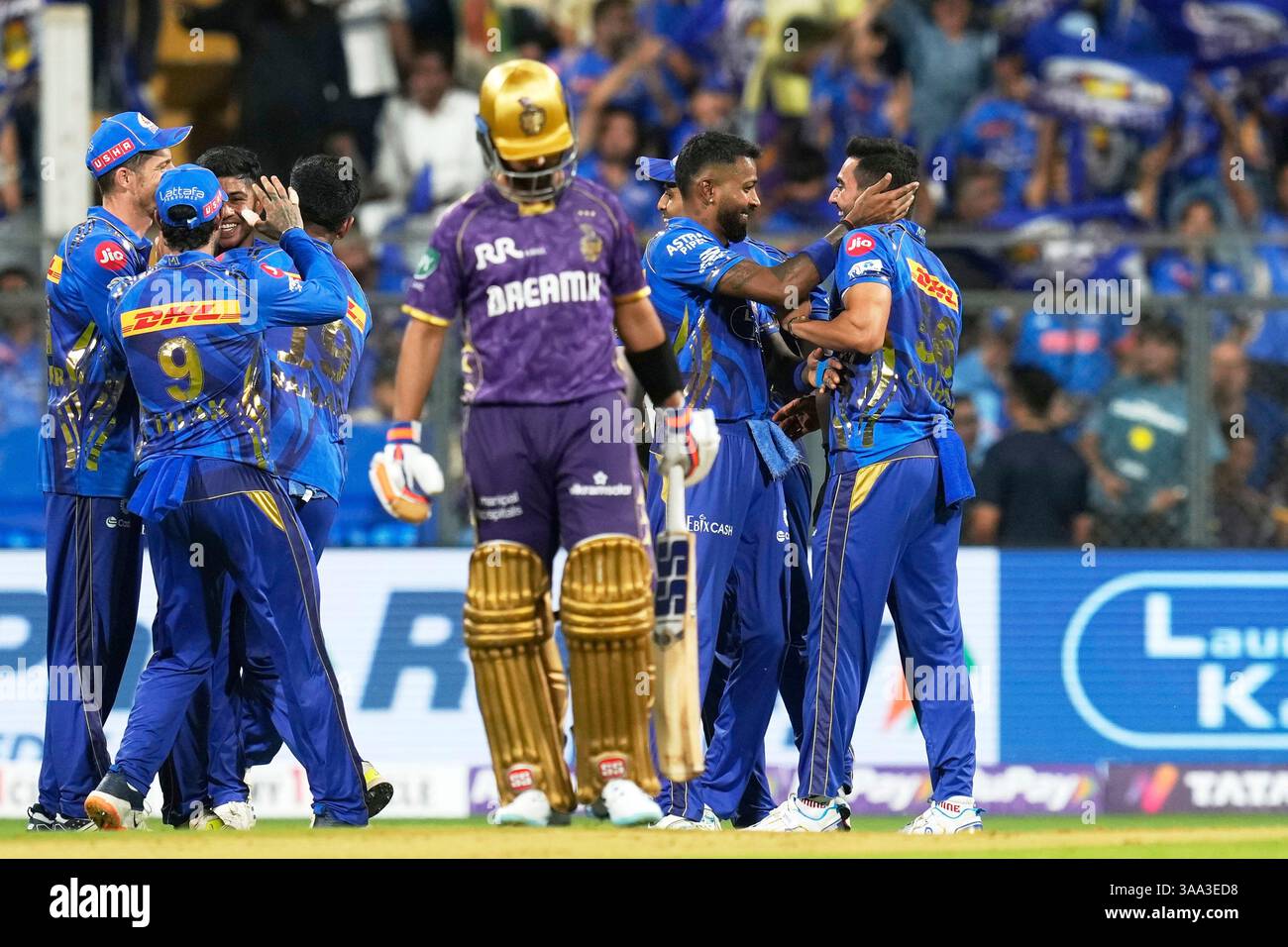 Mumbai Indians' Deepak Chahar, right, and captain Hardik Pandya, second ...