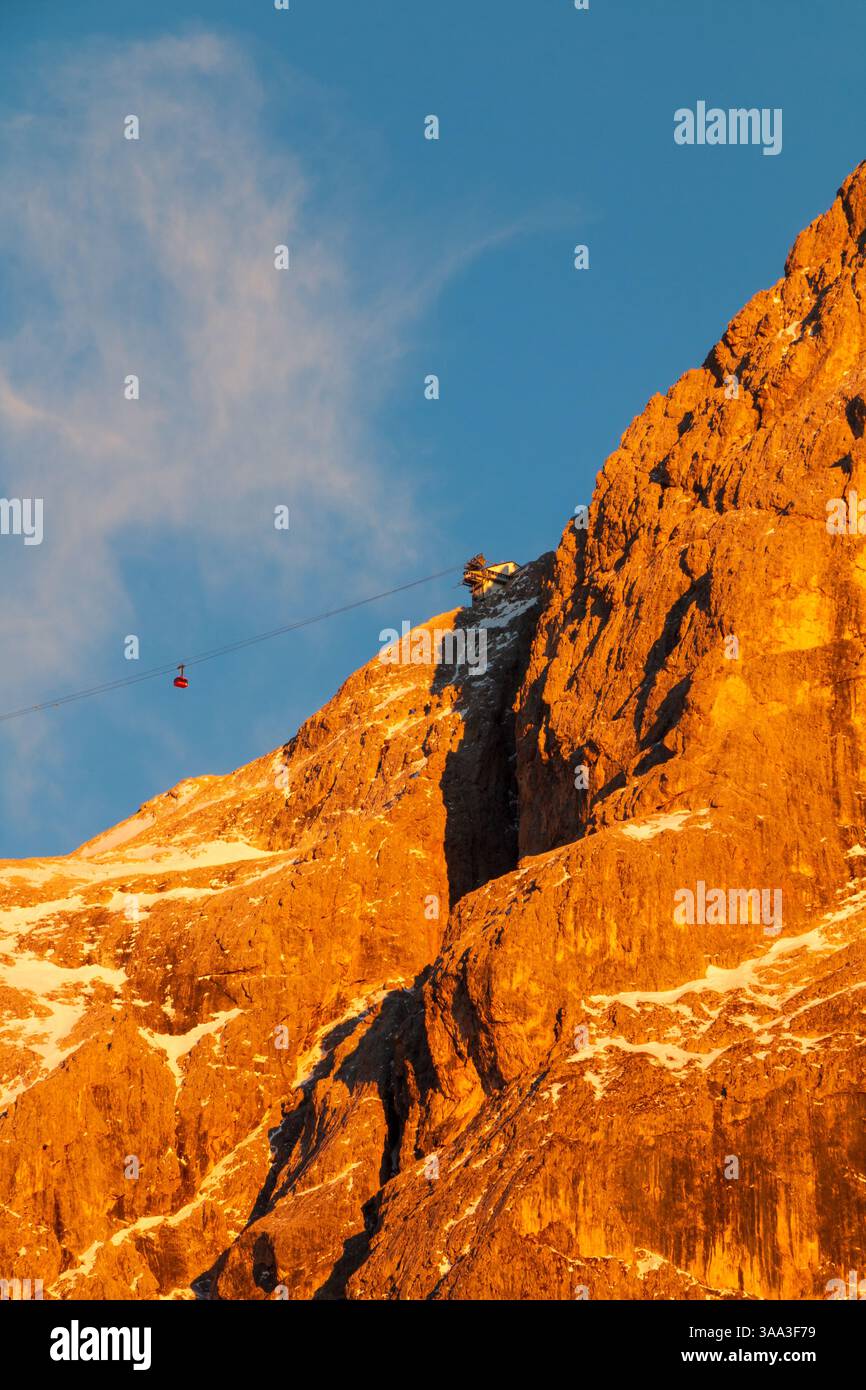 the red cabin of the Rosetta cable car on the Dolomite peaks of San ...