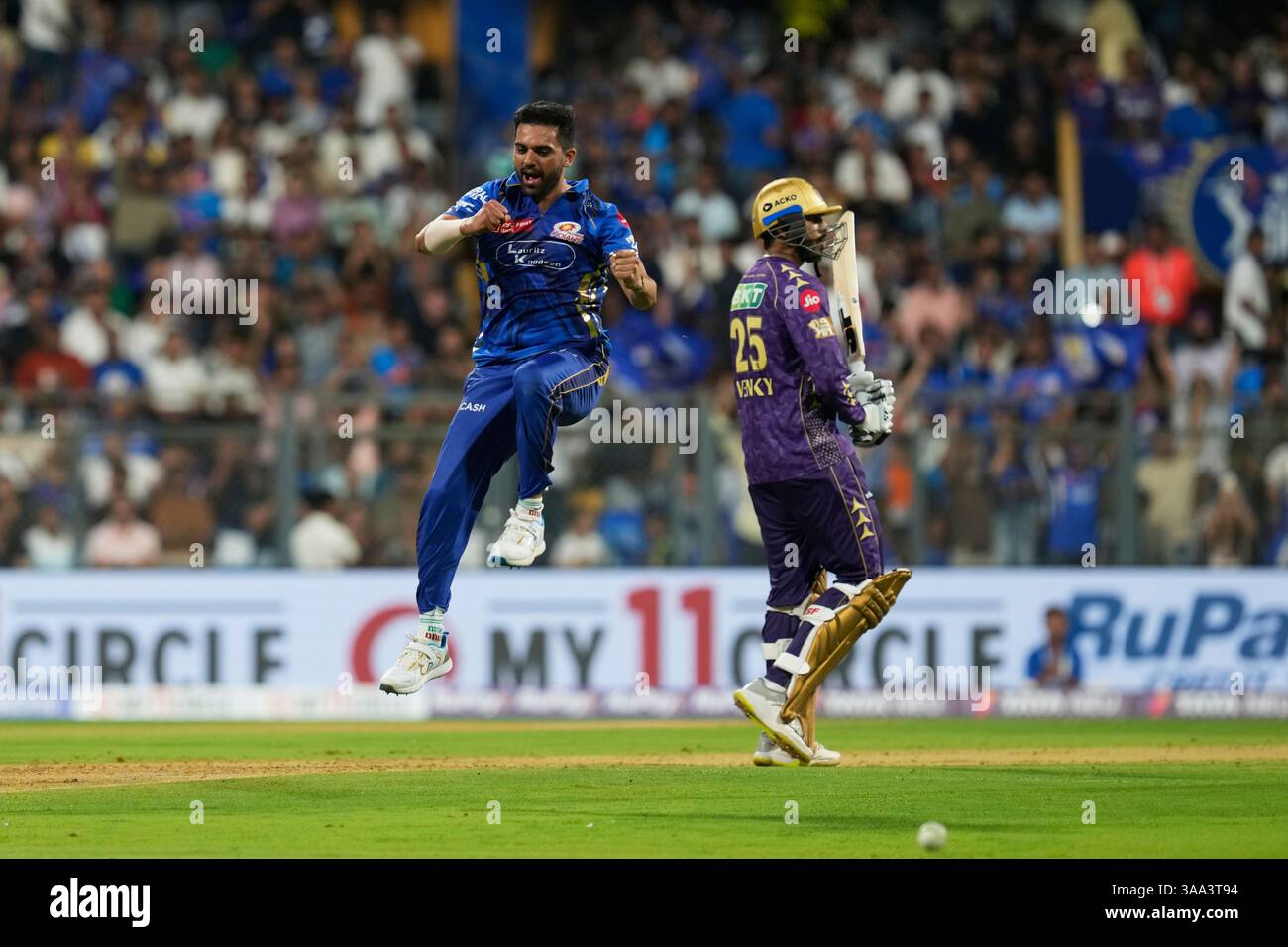 Mumbai Indians' Deepak Chahar, left, celebrates the dismissal of ...