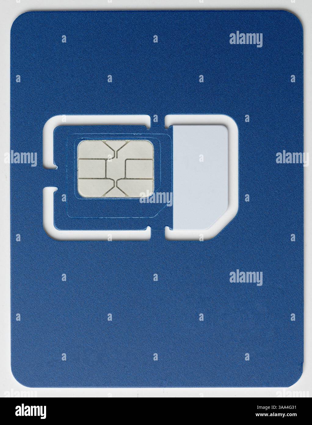 New SIM card lies flat on blue background, prepared for mobile device ...