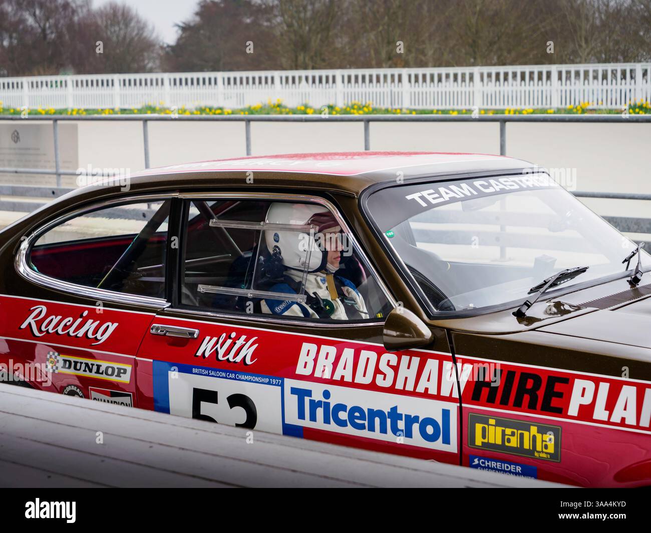 Female racing driver Alice Locke sitting in a Ford Capri racing car, 82 ...