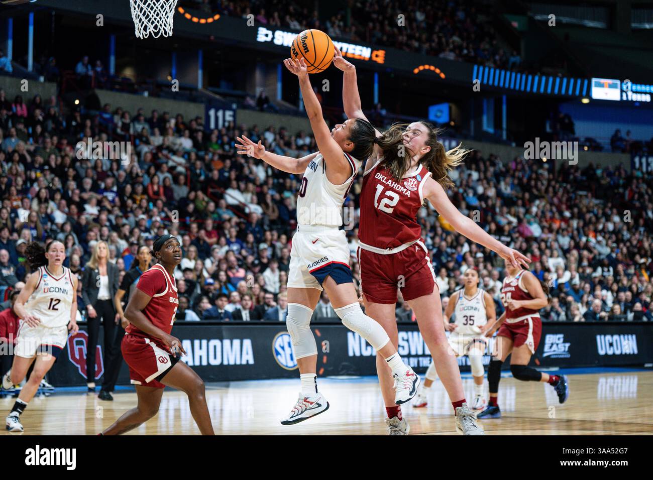Oklahoma Sooners guard Payton Verhulst (12) blocks a shot by UConn ...