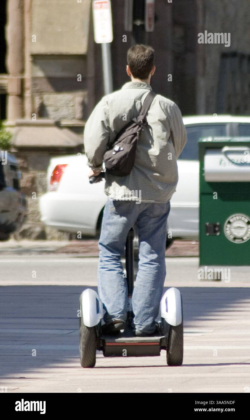 Sep 04, 2006; Boston, MA, USA; A young man rides a Segway Scooter ...