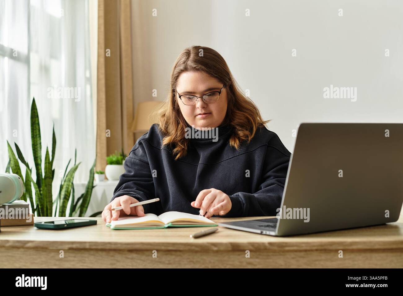 In a cozy home, a young woman with Down syndrome studies with great ...