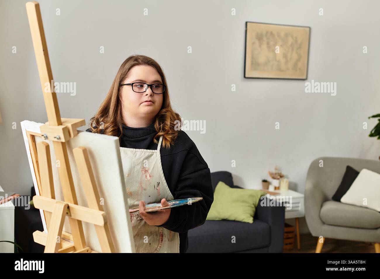 A young woman with Down syndrome shares her creativity while painting ...