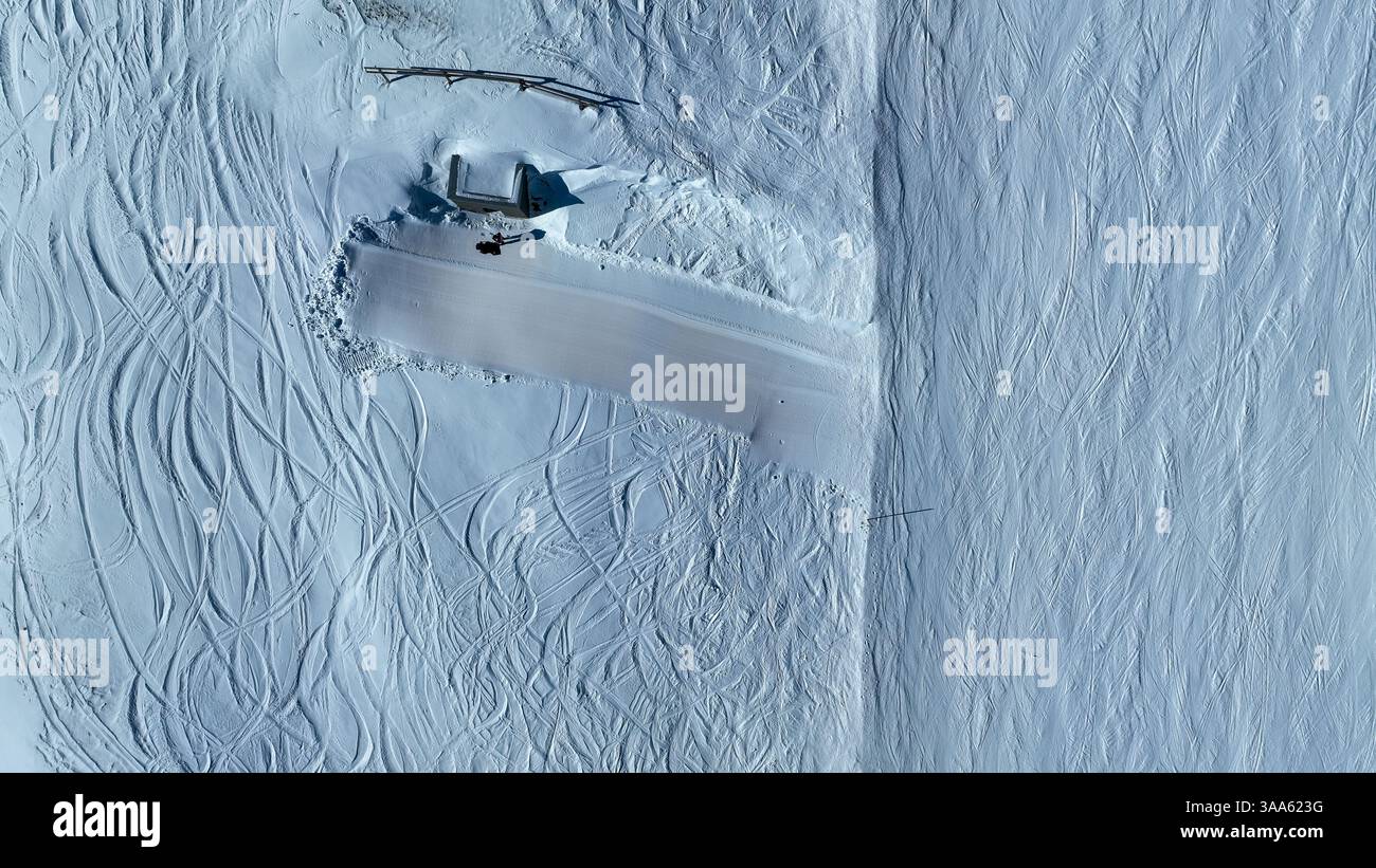 Aerial view of snow covered mountain with impressive structure. Snow ...