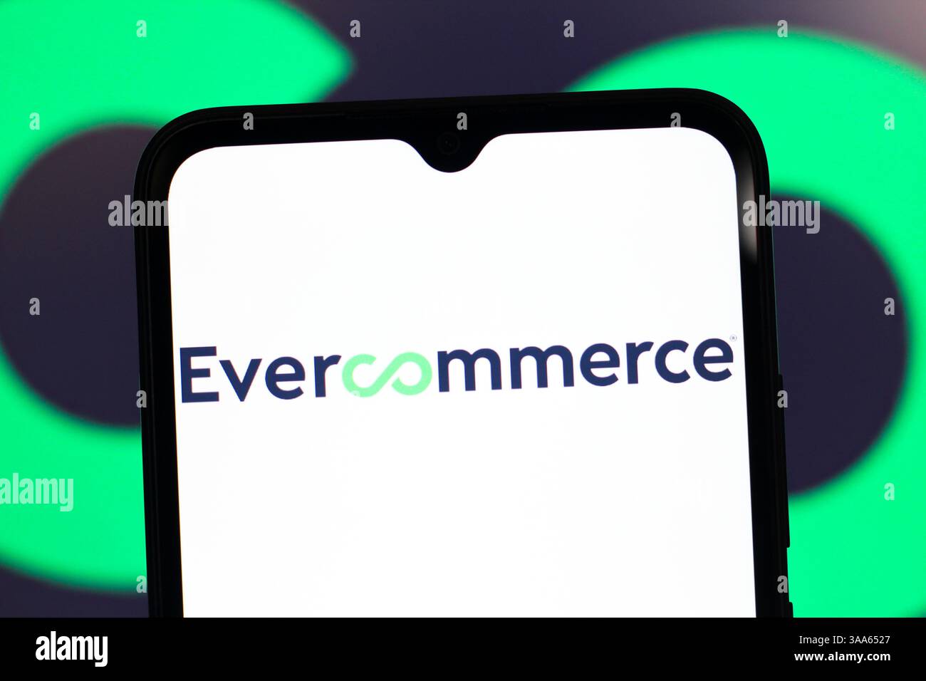 In this photo illustration, the EverCommerce logo is seen displayed on ...