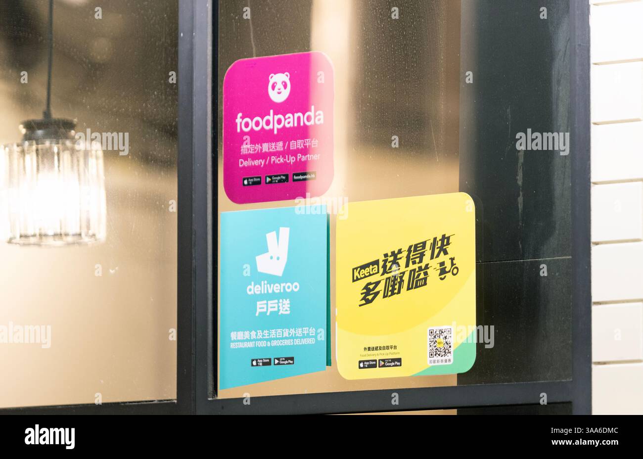 Hong Kong -March 31 2025: the label of Deliveroo HK, Foodpanda and Keeta at the counter of ...