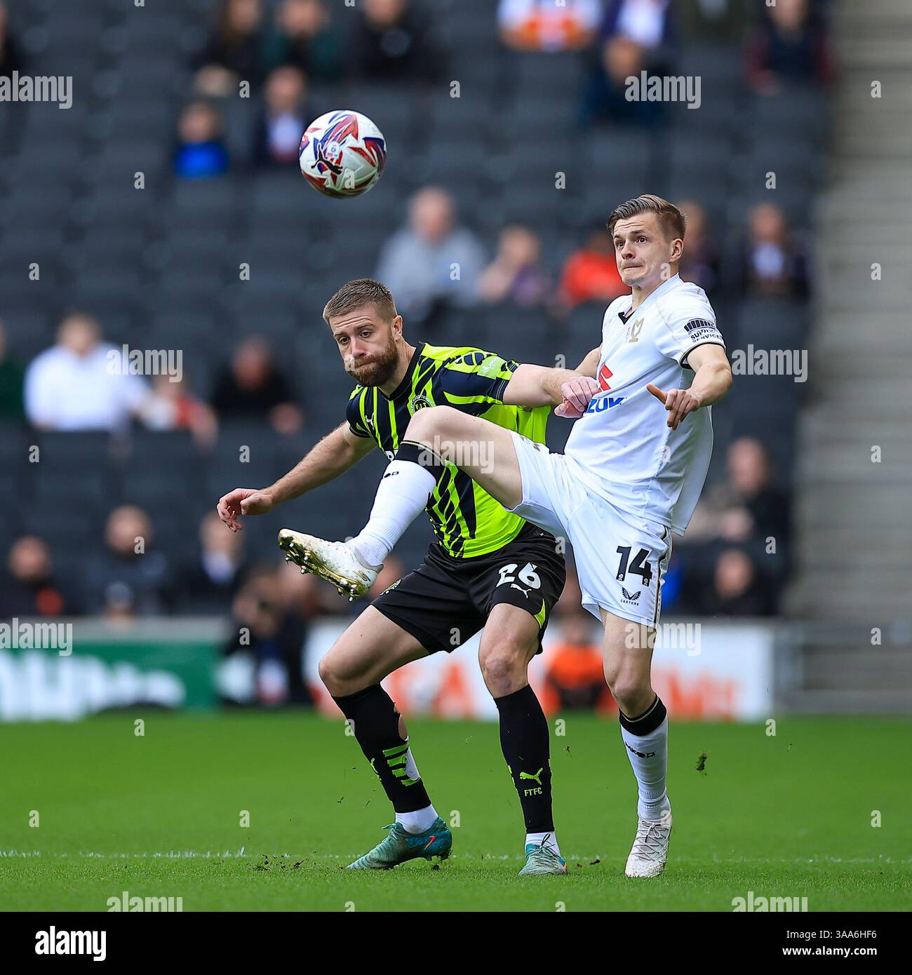 Milton Keynes Dons Defender Joe Tomlinson (14) Under Pressure from ...