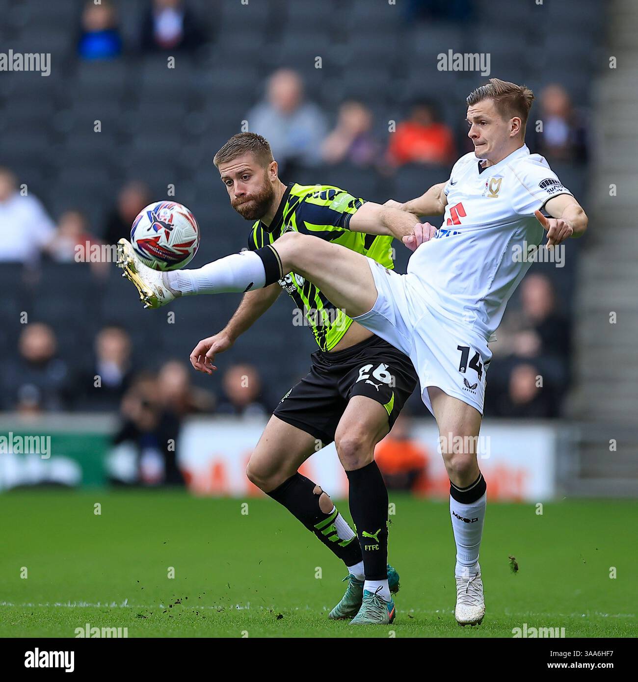 Milton Keynes Dons Defender Joe Tomlinson (14) Under Pressure from ...