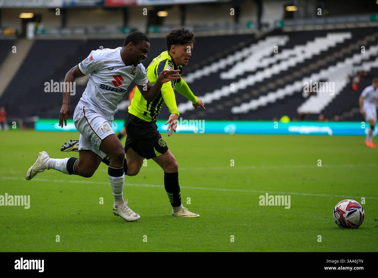 Milton Keynes Dons Midfielder Aaron Nemane (16) Battles for the ball ...