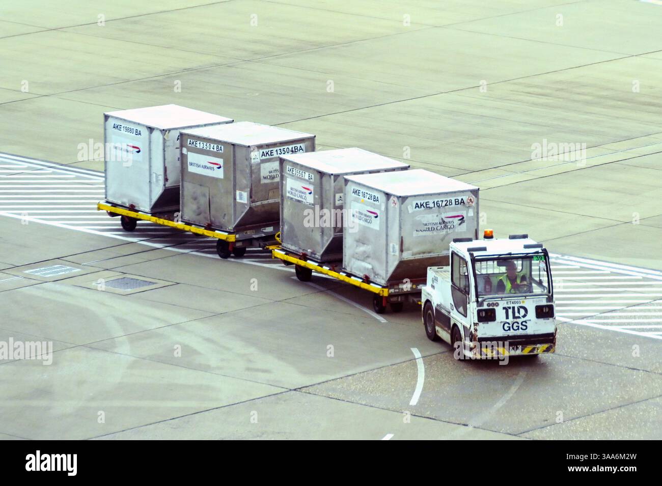 London, England, UK - 1 August 2023: Small tractor pulling a train of ...