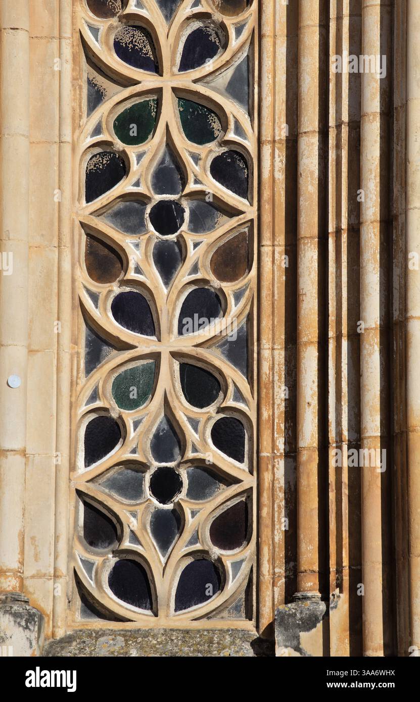 Detailed gothic window designs of the Batalha Monastery capture the ...