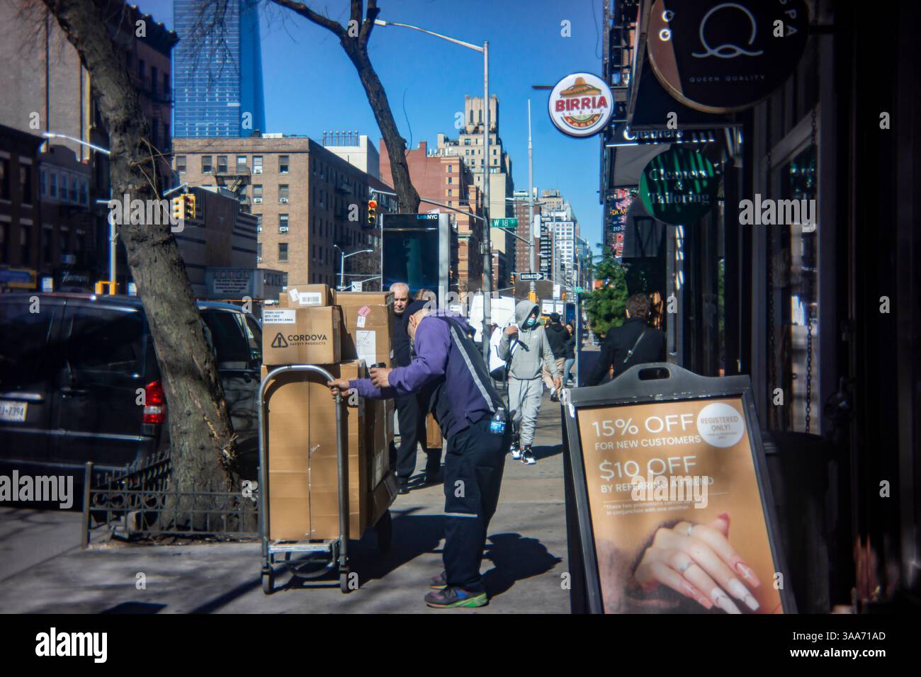 FedEx worker with cart and deliveries in Chelsea in New York on Tuesday ...