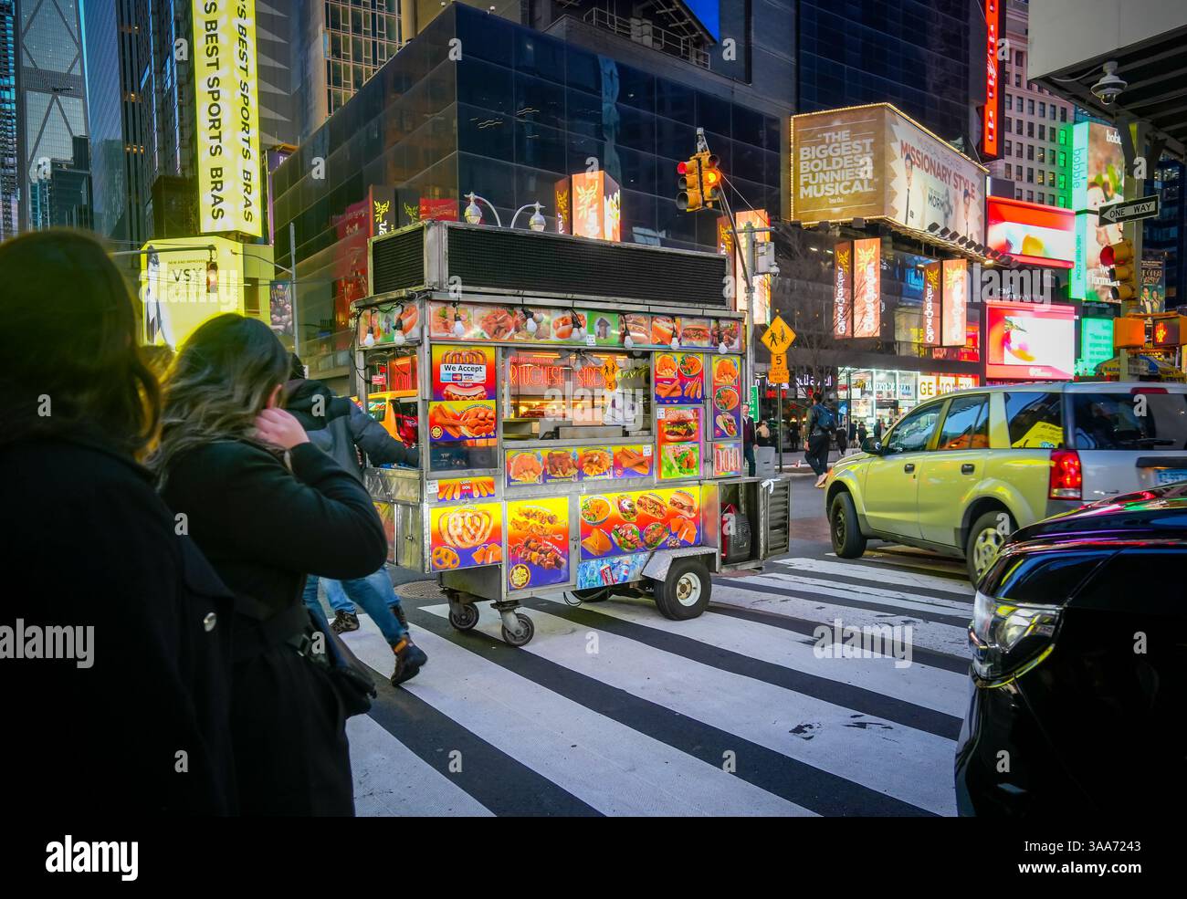 Hot dog vendor schlepps his cart in Times Square in New York on ...