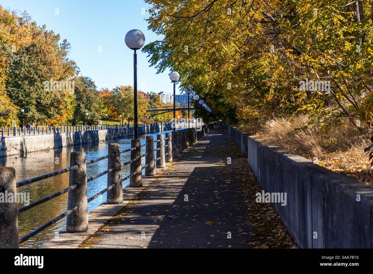 Sidewalk along Rideau Canal in Ottawa, Canada during the autumn season ...