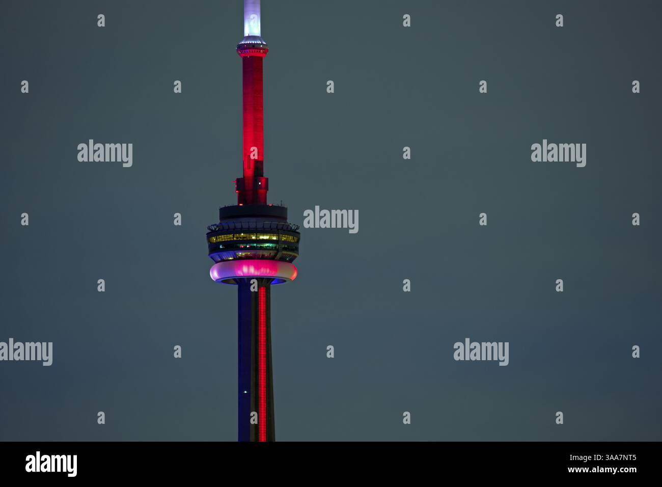 Illuminated CN Tower in Toronto, Canada, with a close-up of the ...