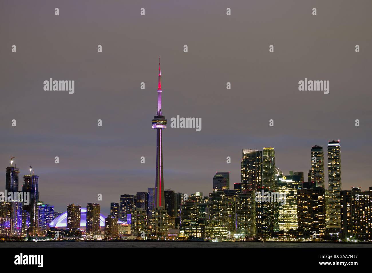 Toronto skyline at night as seen from the Toronto Islands, featuring ...
