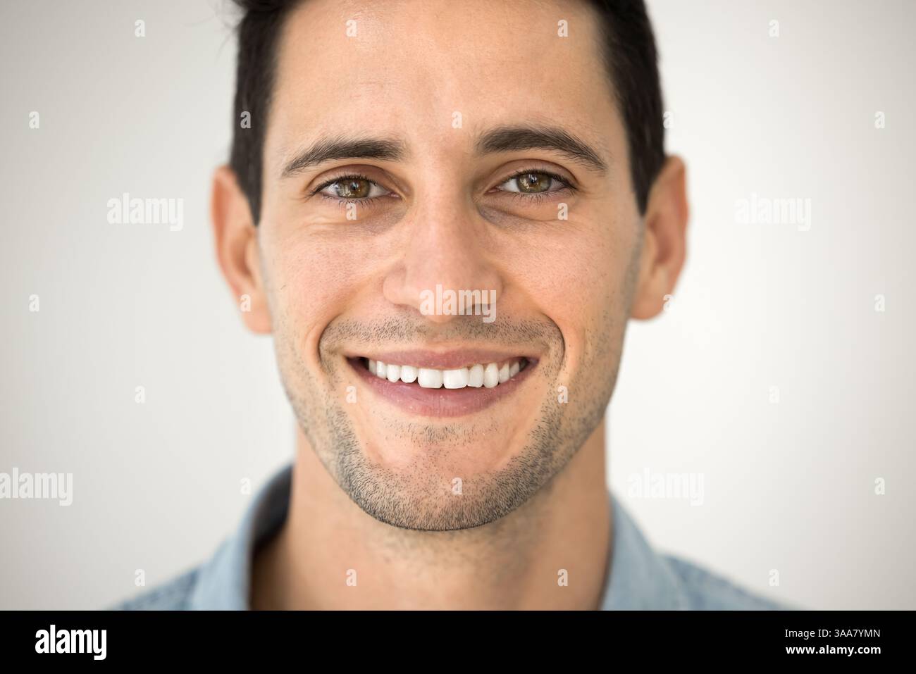 Close up happy Latin man smiling revealing perfect-white teeth Stock ...